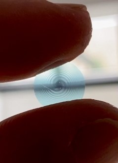Spiral-shaped lens provides clear vision at a range of distances and ...